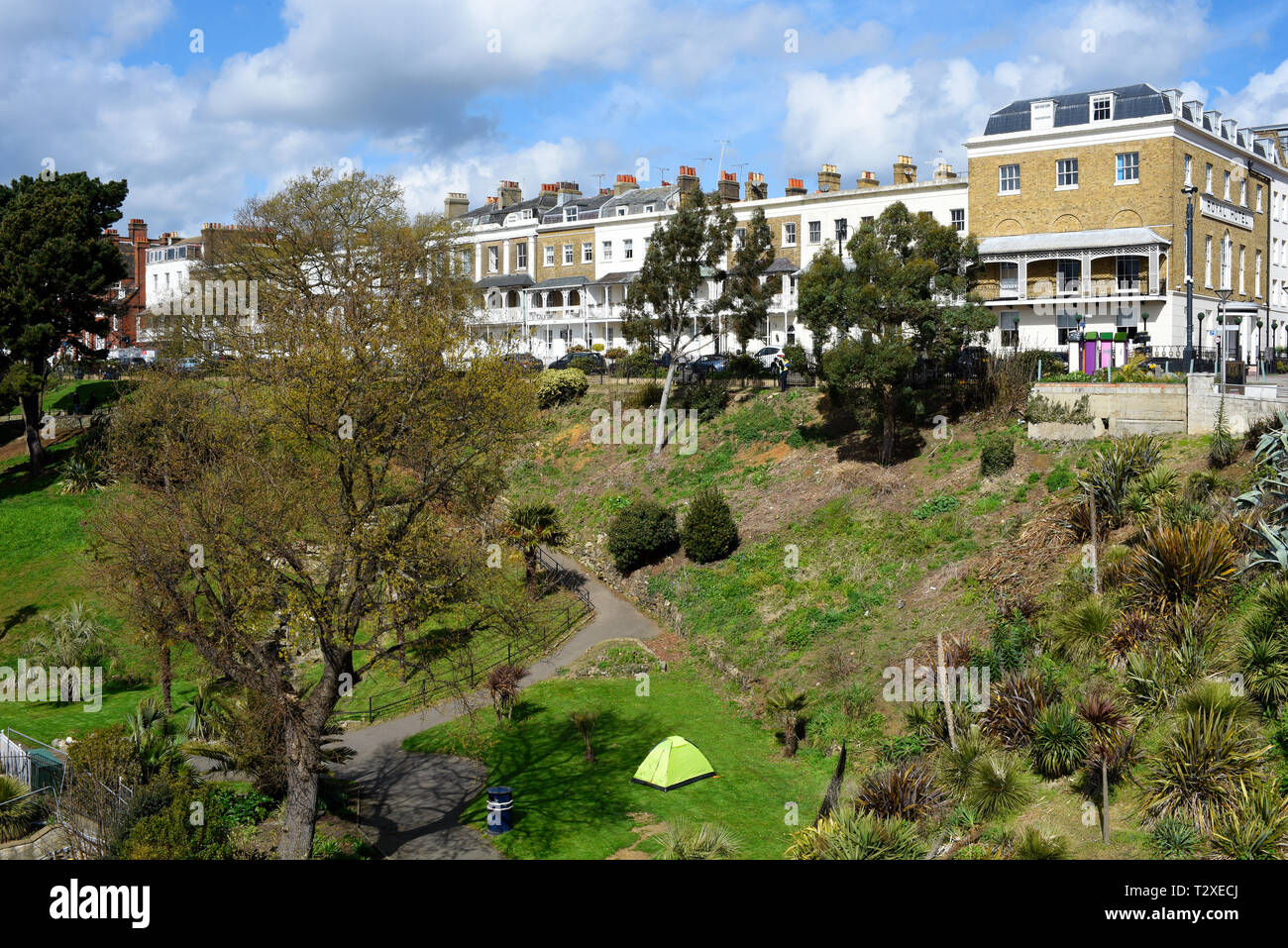 Homeless person camping in the shrubbery gardens below Royal Hotel and ...