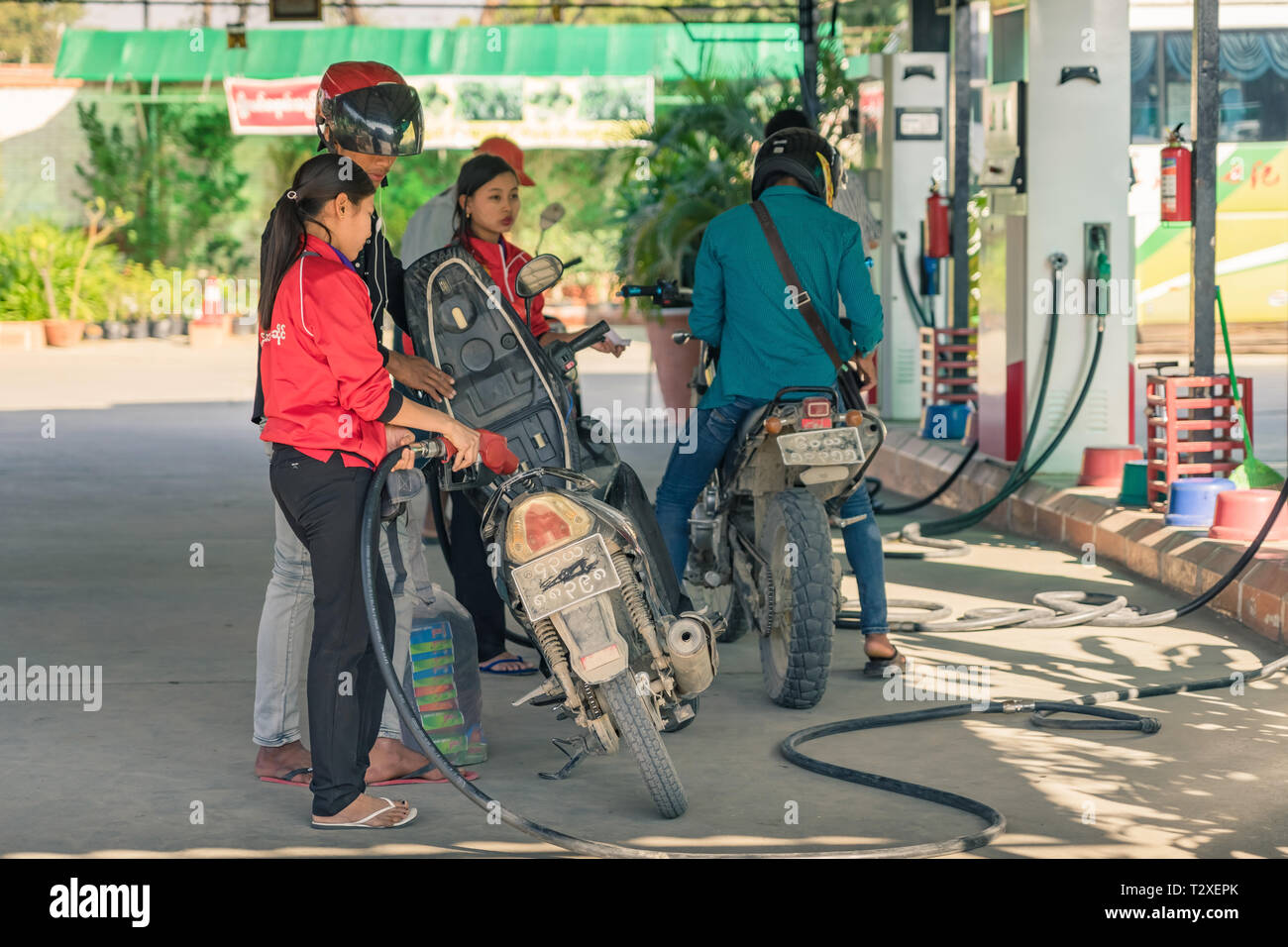 Motorcycle rider waiting gas pump hi-res stock photography and images ...