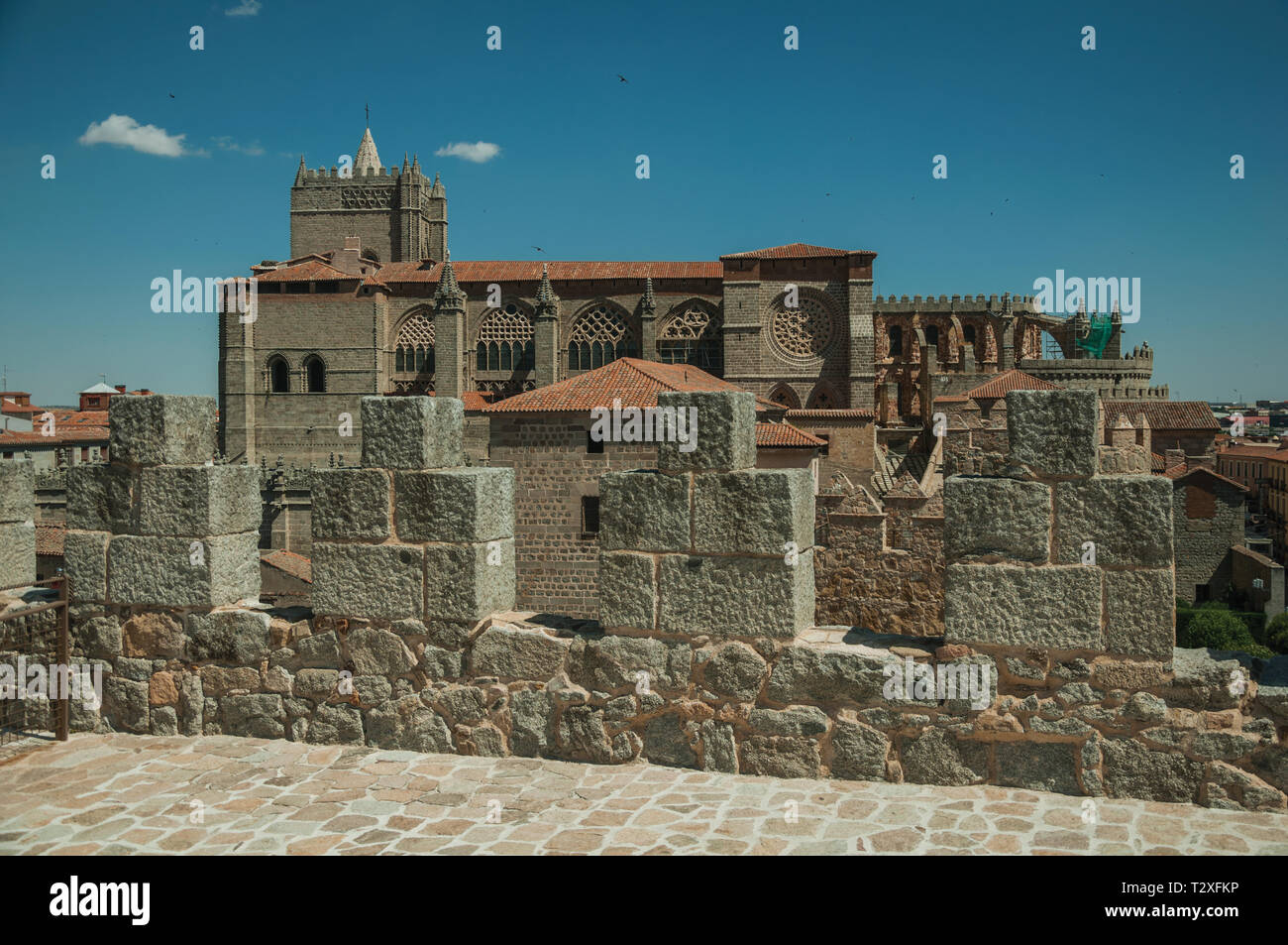 Stone thick wall with battlement and merlons next to the Cathedral at ...