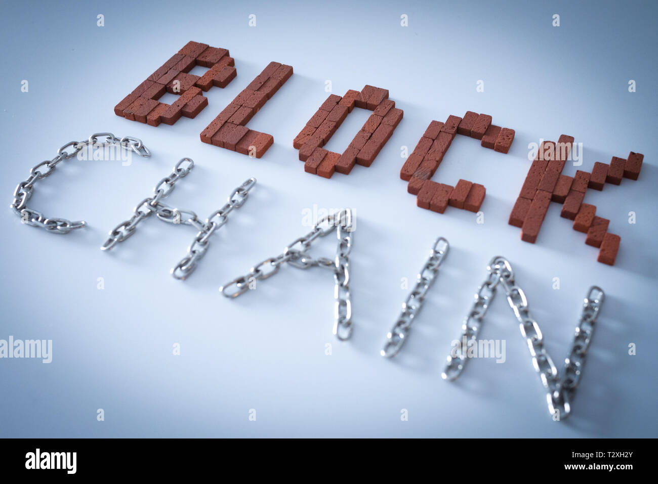 Blockchain illustration written with bricks and chains to visualize ...