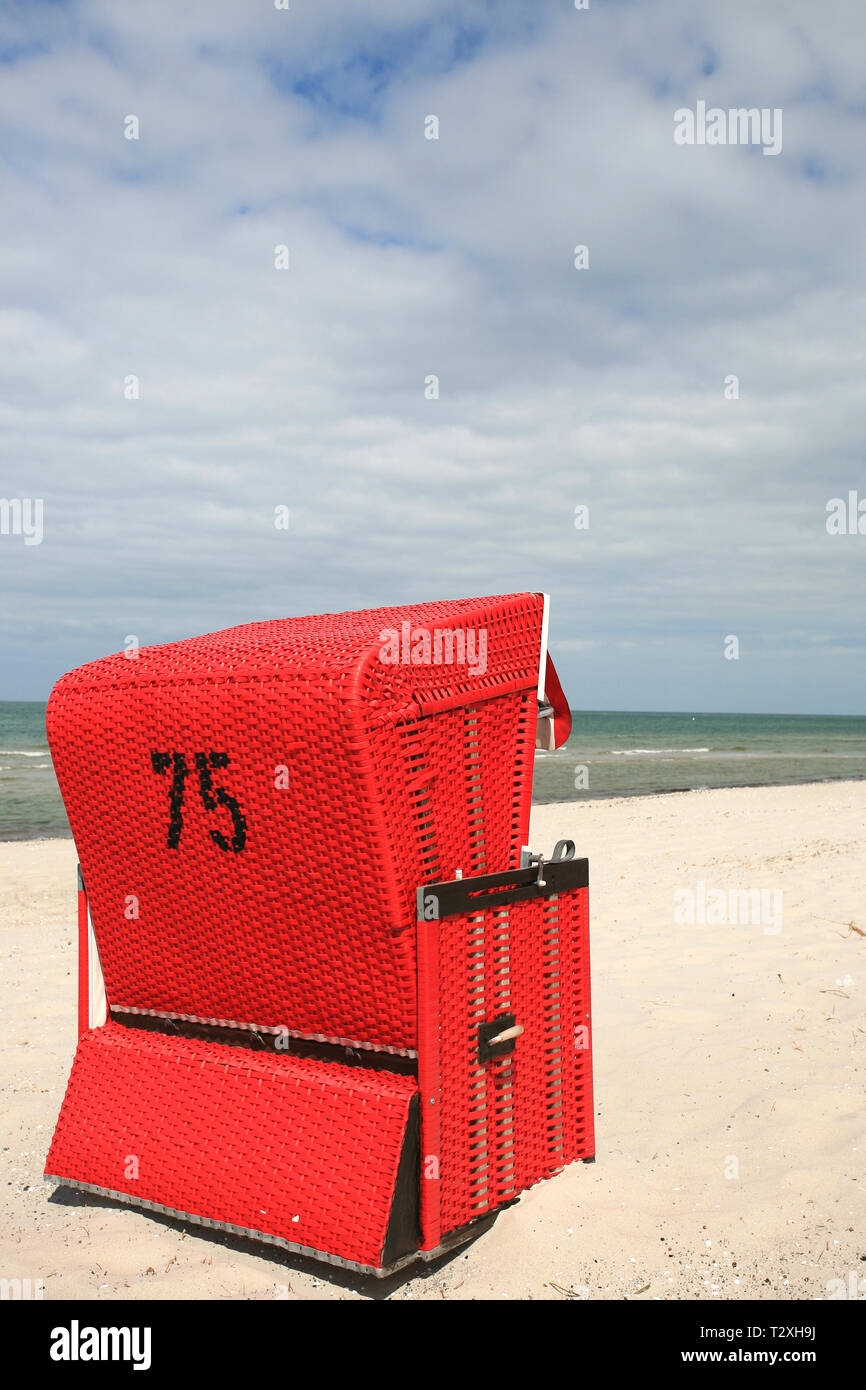 Red roofed wicker beach chair on the beach by the Baltic Sea Stock ...