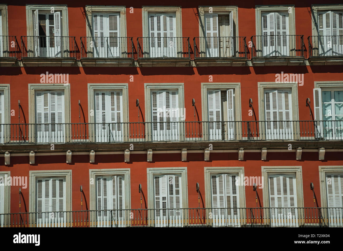 Old building with colorful facade and windows with iron balustrade in ...