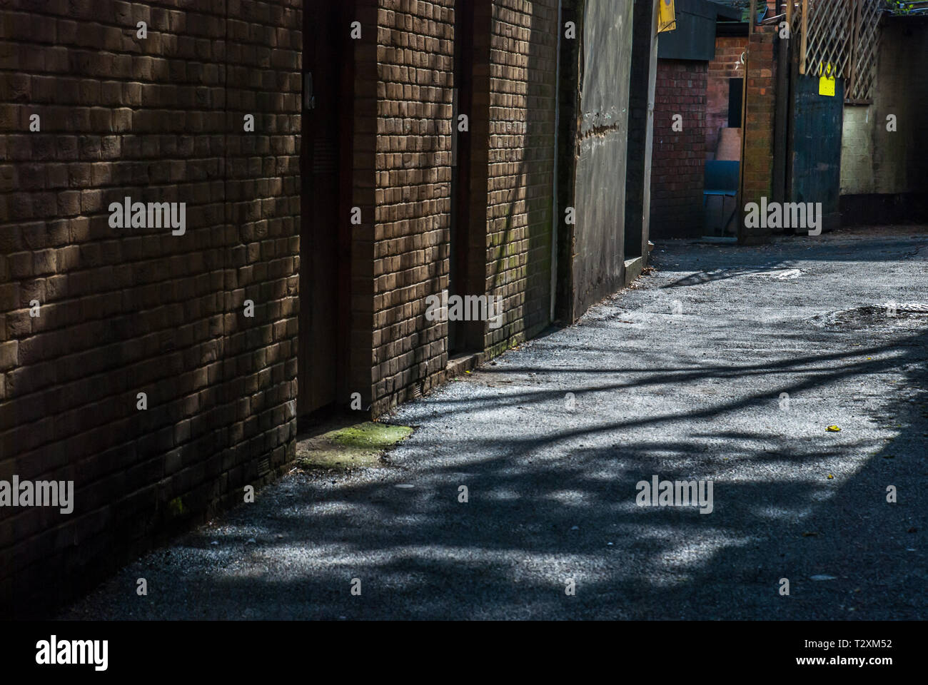 The shadow that shines into the beautiful alley. London Stock Photo - Alamy