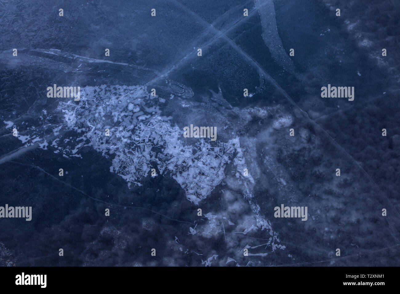 The silty waters of Alaska's Knik River combine with the cracks and ...