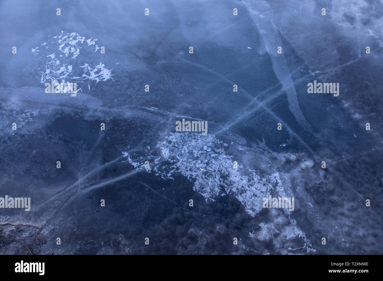 The silty waters of Alaska's Knik River combine with the cracks and ...
