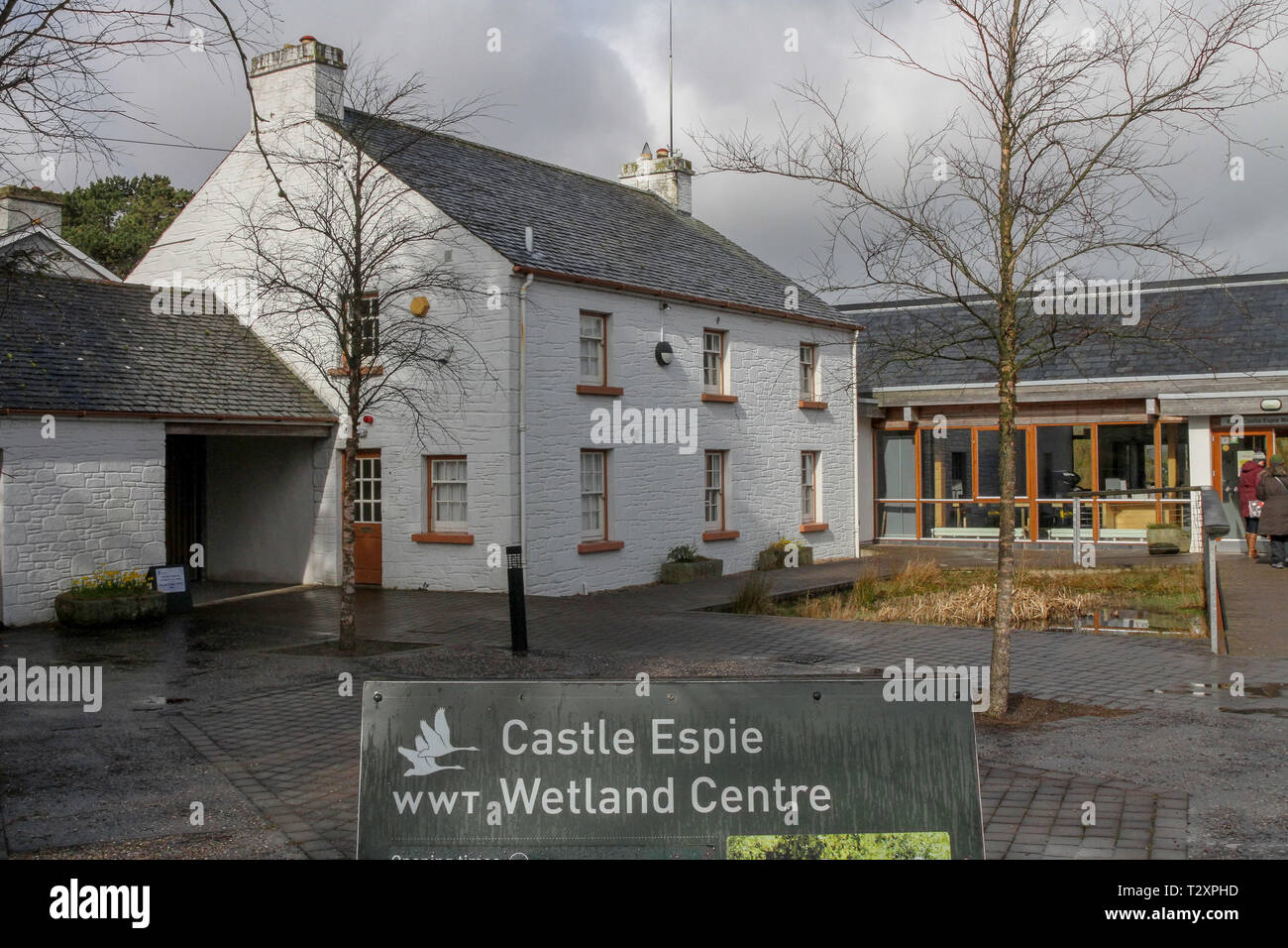 Two people entering the main entrance at WWT Castle Espie Wetland ...