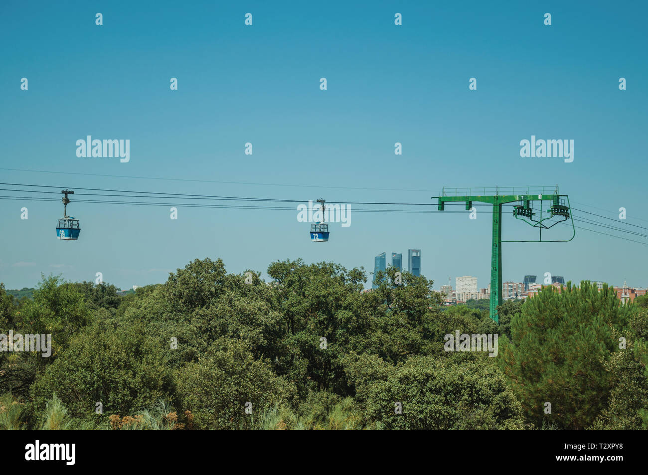 Cable car gondola passing through big supporting towers at the ...