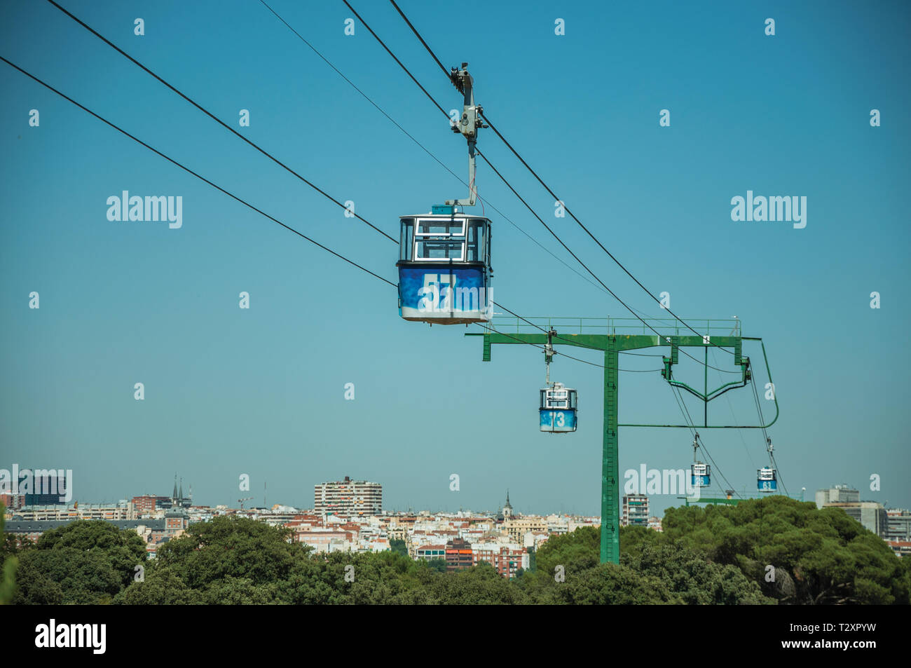Cable car gondola passing through big supporting towers at the ...