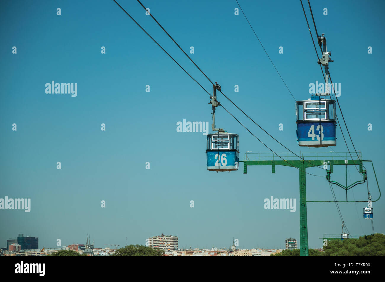 Cable car gondola passing through big supporting towers at the ...