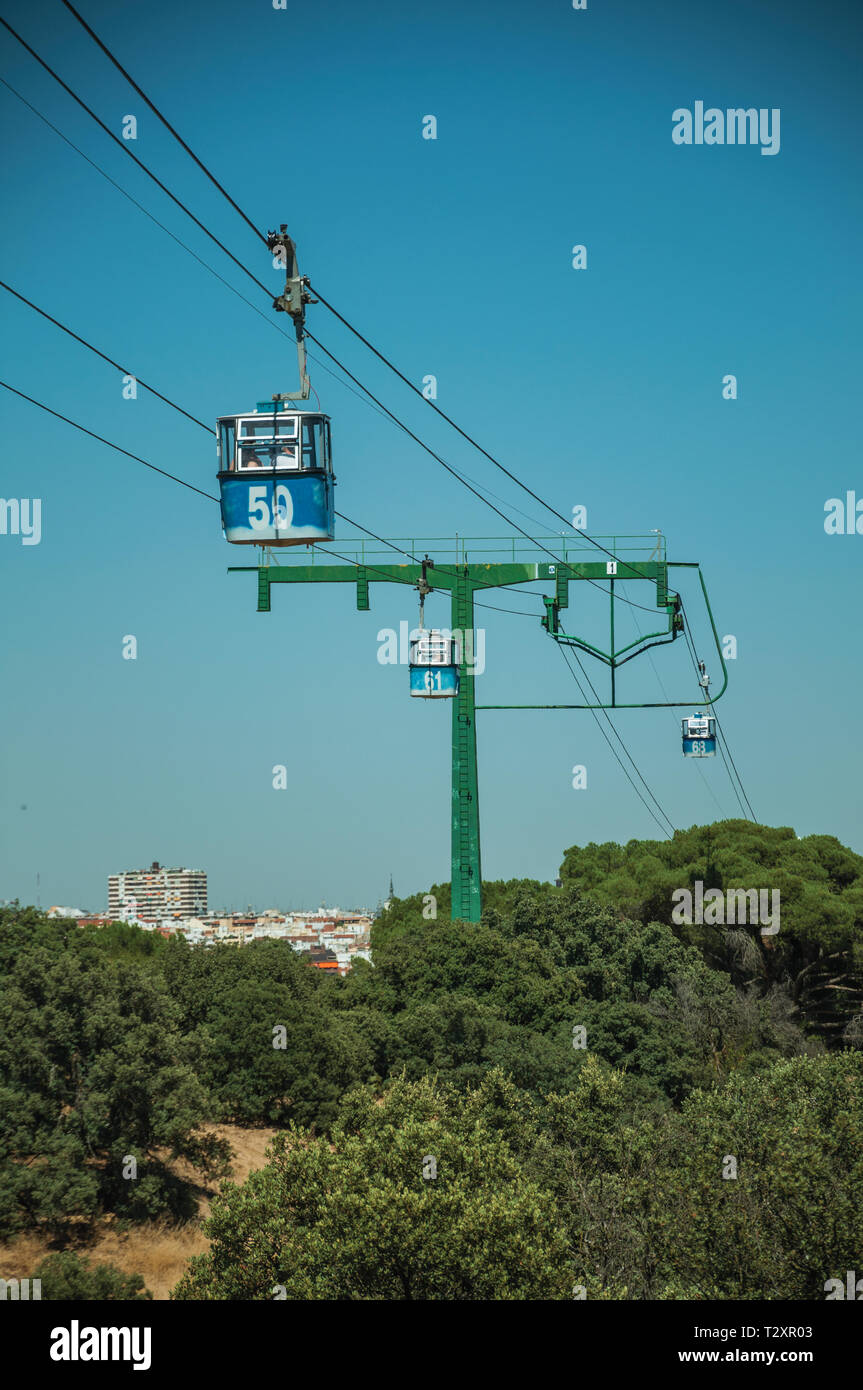 Cable car gondola passing through big supporting towers at the ...