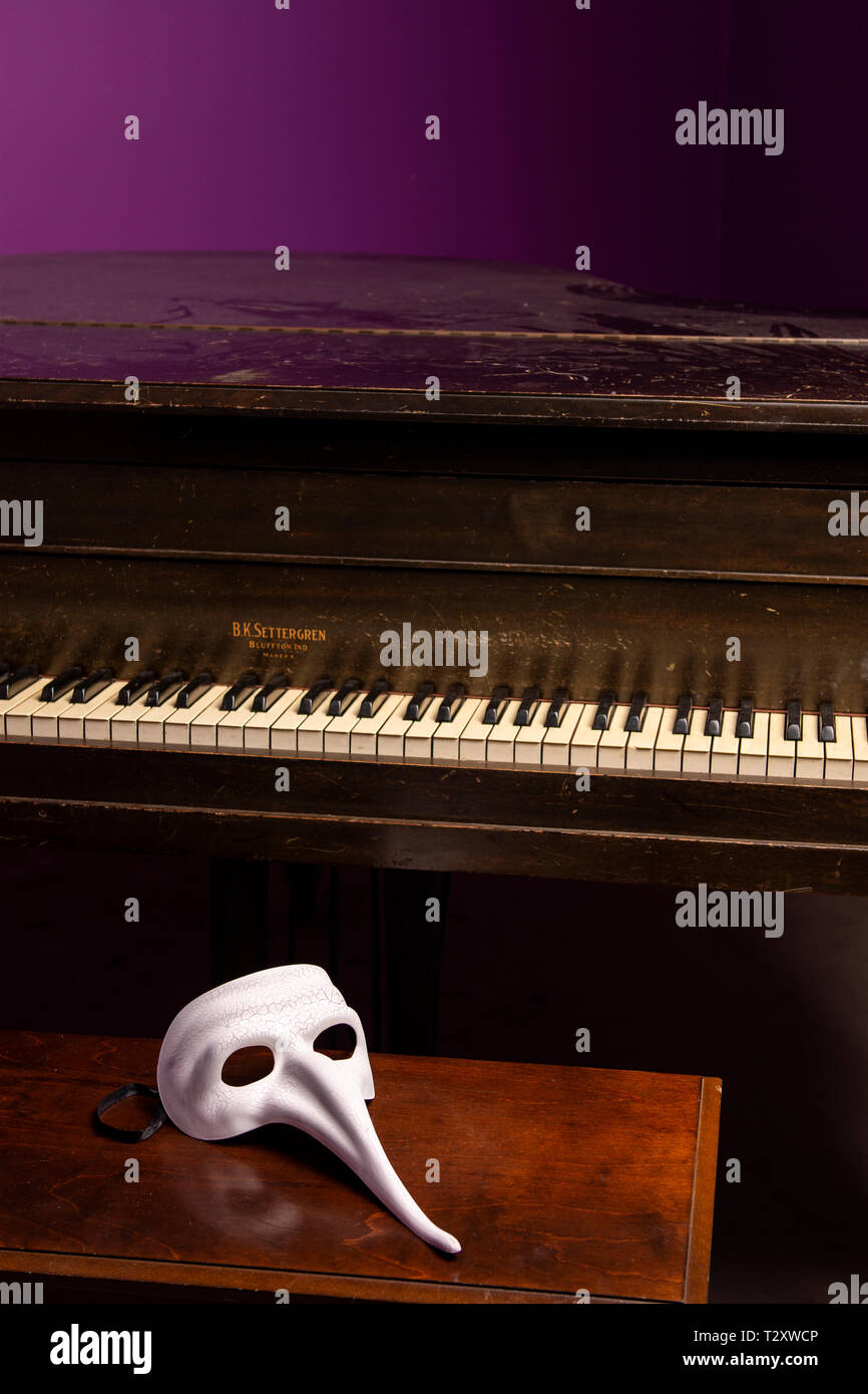 A white mask on a piano Stock Photo - Alamy