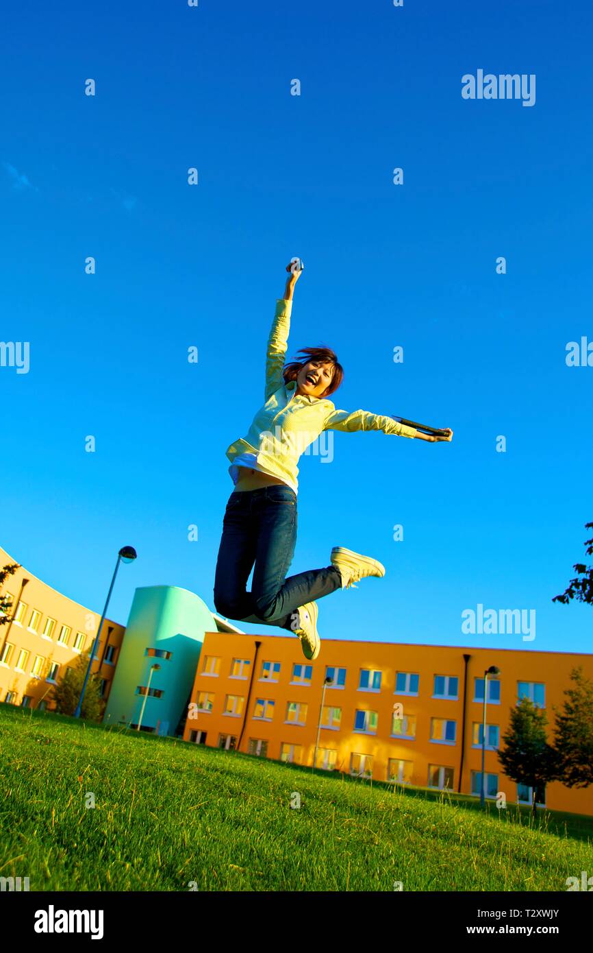 Asian Female Student Celebrating Stock Photo - Alamy