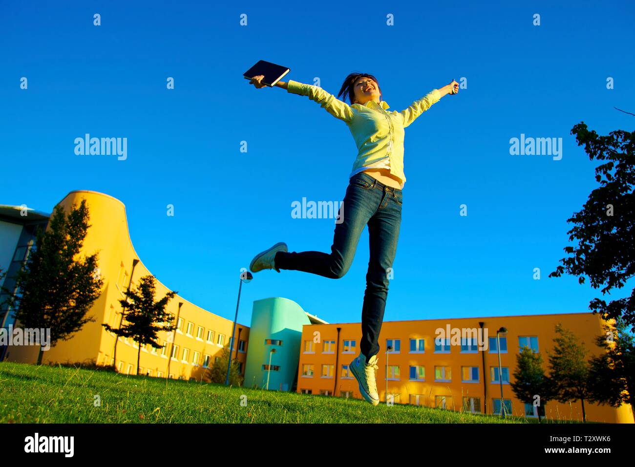 Asian Female Student Celebrating Stock Photo - Alamy