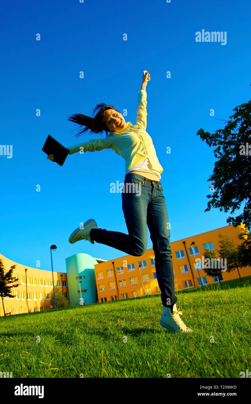 Asian Female Student Celebrating Stock Photo - Alamy