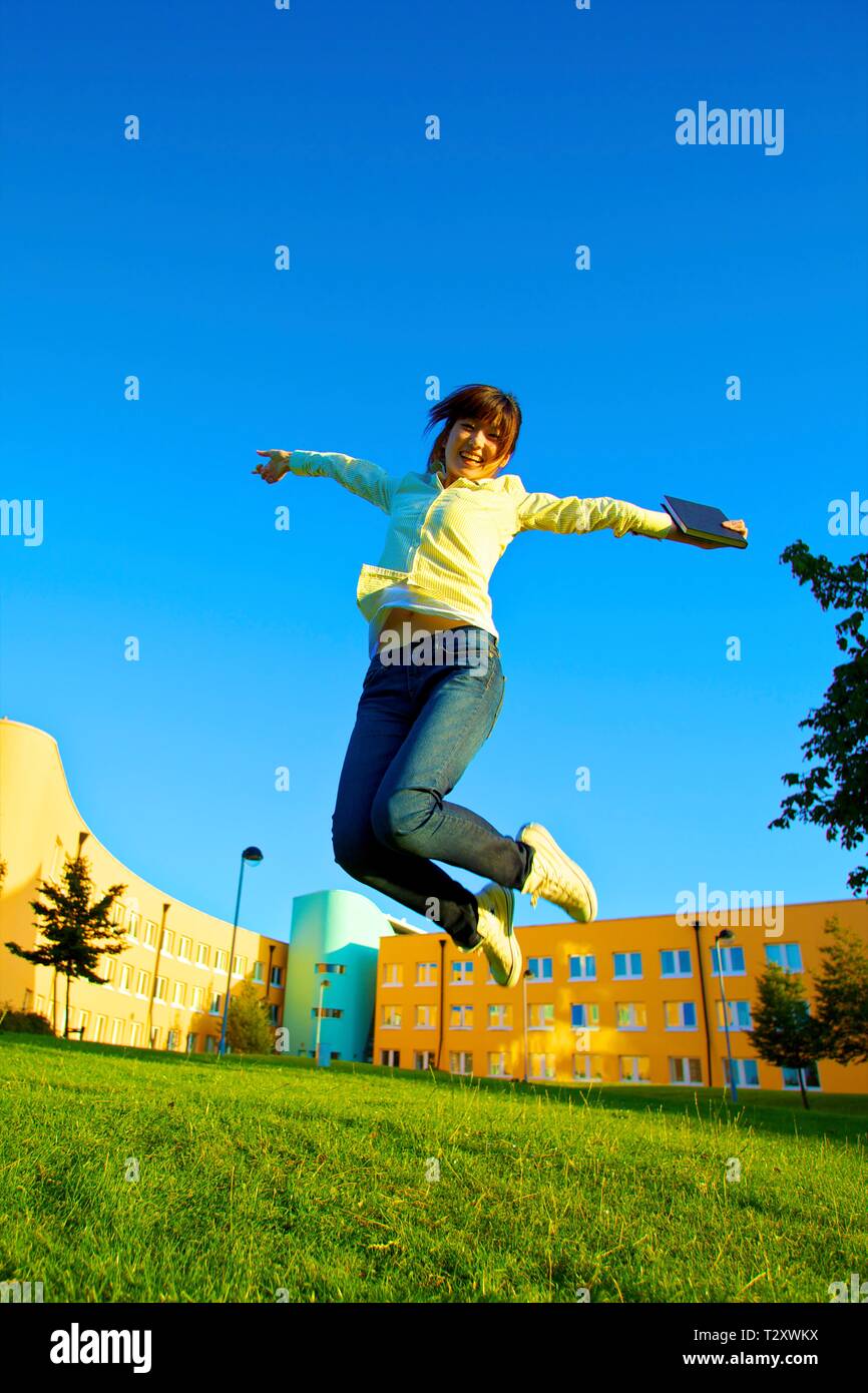 Asian Female Student Celebrating Stock Photo - Alamy