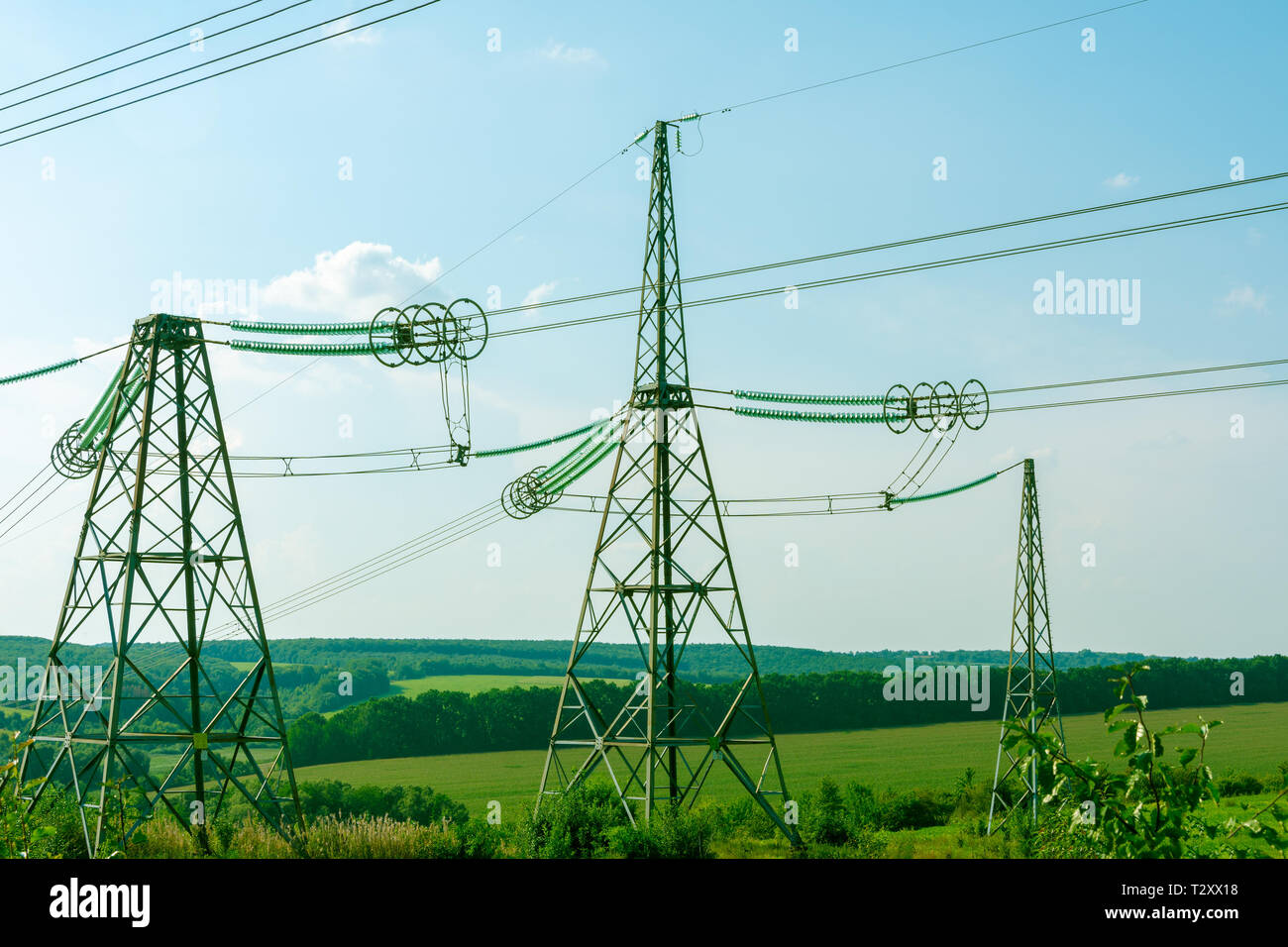 power line close-up on a blue sky background using toning. Energy and ...