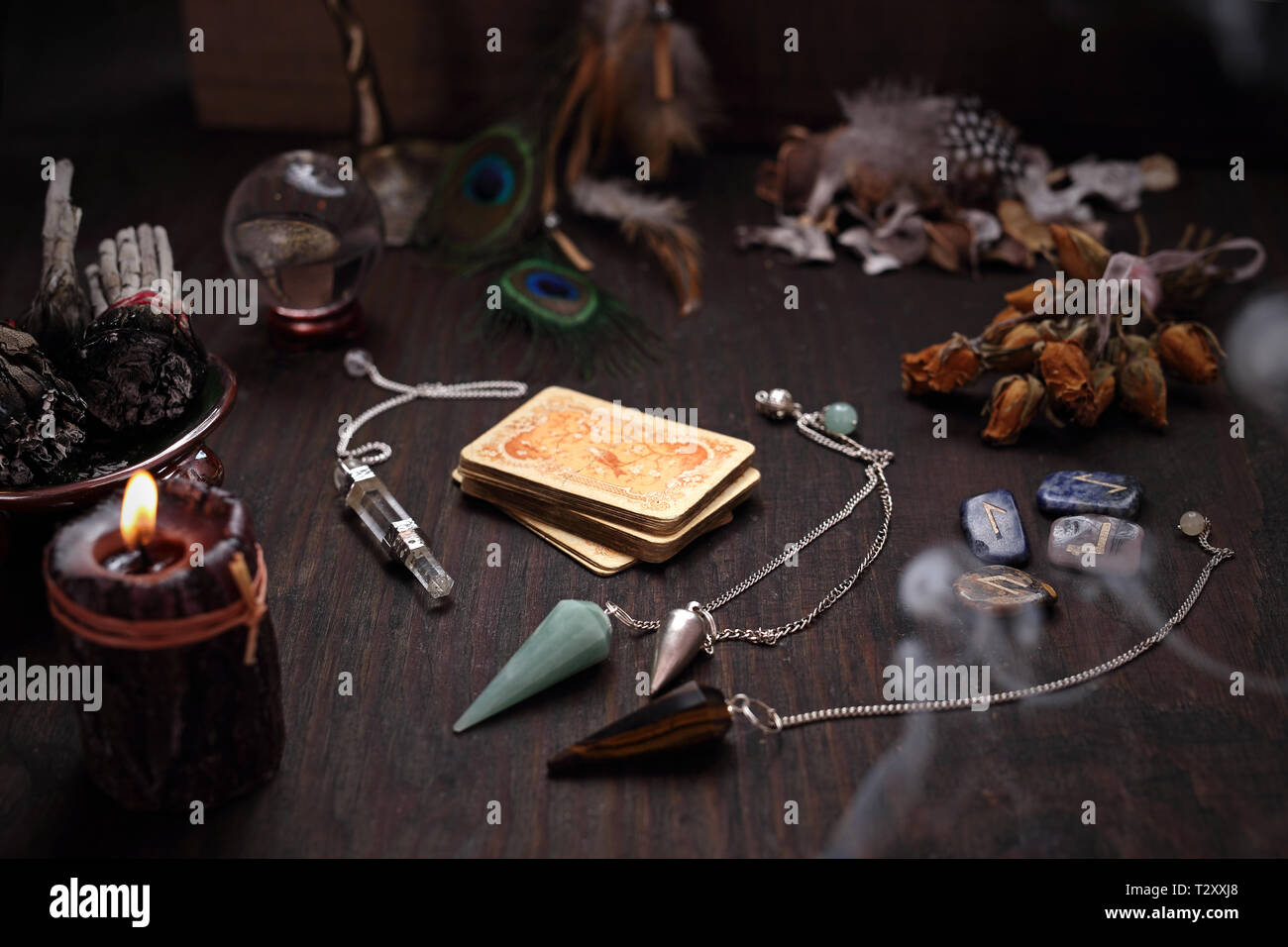 Faerie accessories. A deck of old divination cards and a stone pendulum ...