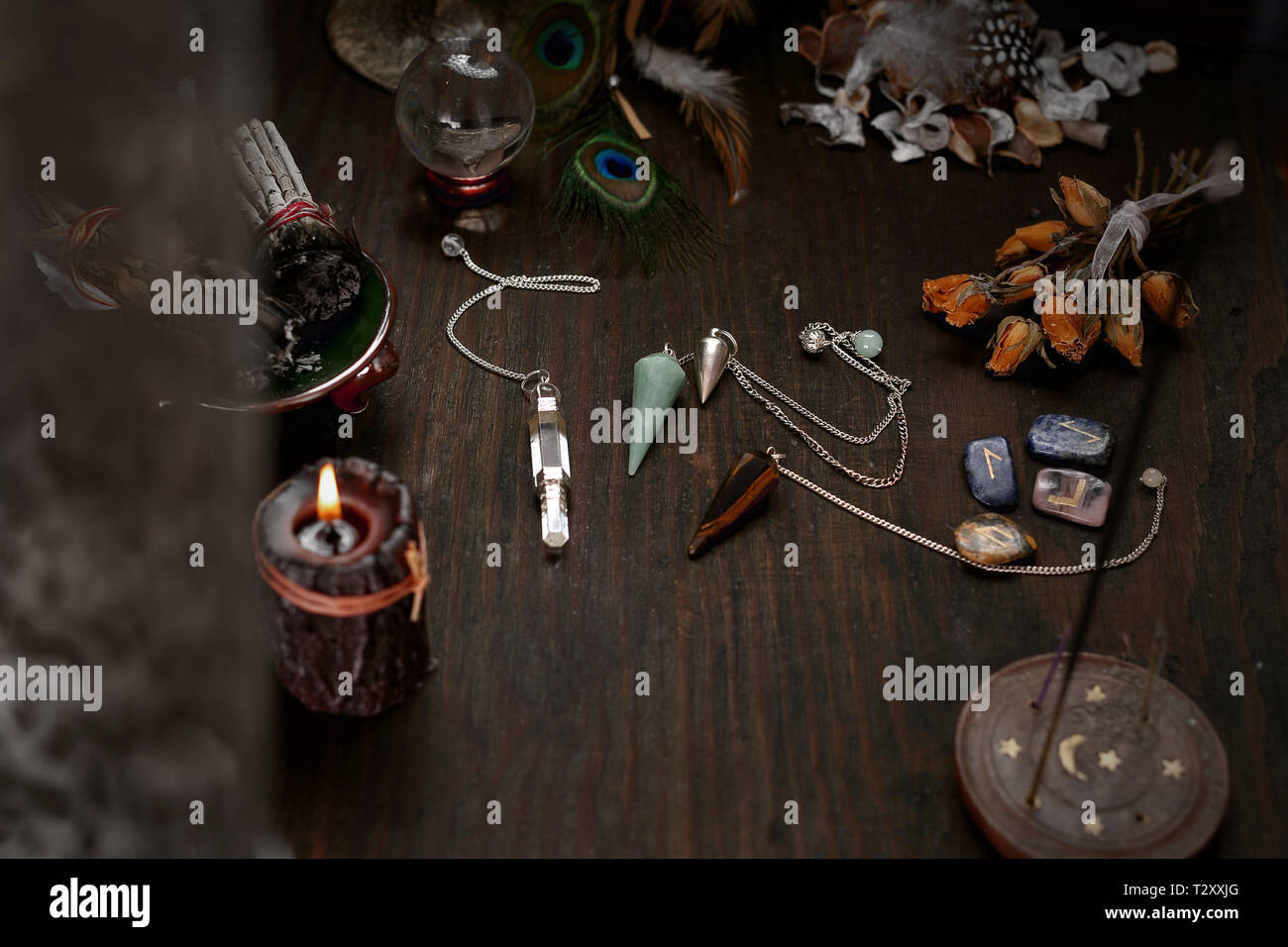 Faerie accessories. A deck of old divination cards and a stone pendulum ...