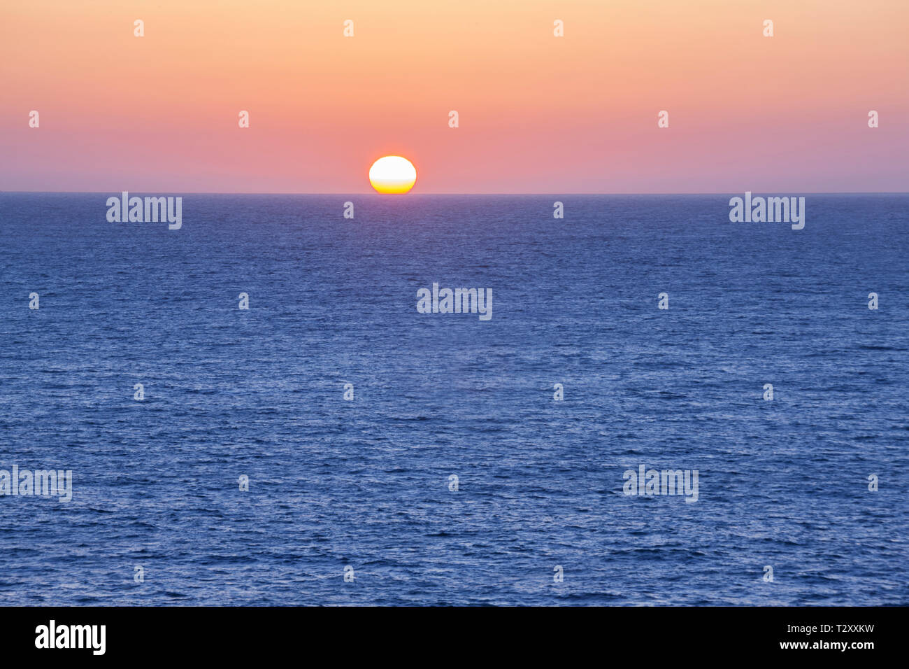 Sunset in sea Stock Photo - Alamy