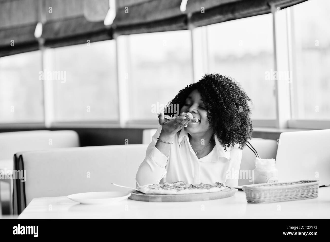 Сheerful business african american lady with afro hair, wear white ...