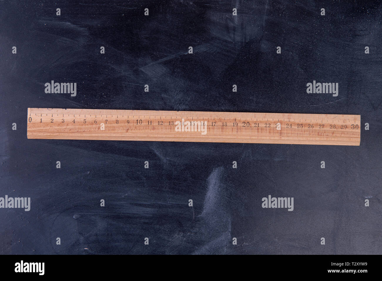 Ruler in the middle on a blackboard Stock Photo - Alamy