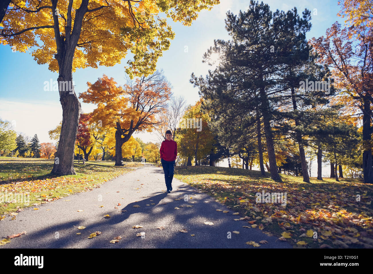 Boy walking alone hi-res stock photography and images - Alamy