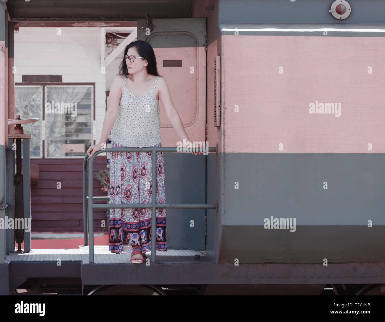 Woman standing outdoor train hi-res stock photography and images - Alamy