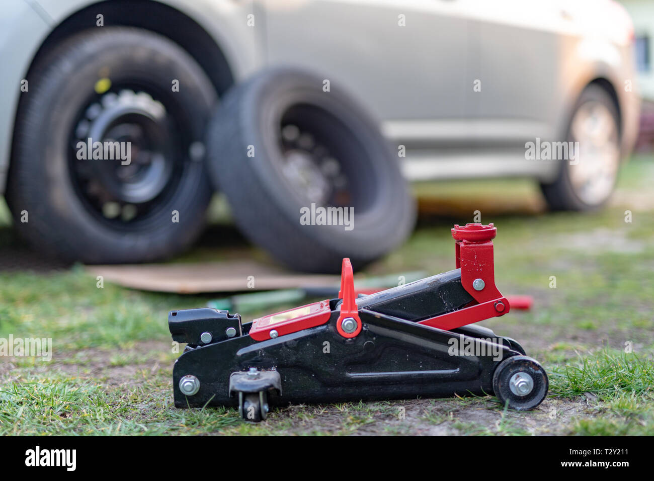 Replacing the wheel in a passenger car. Changing wheels from winter to ...