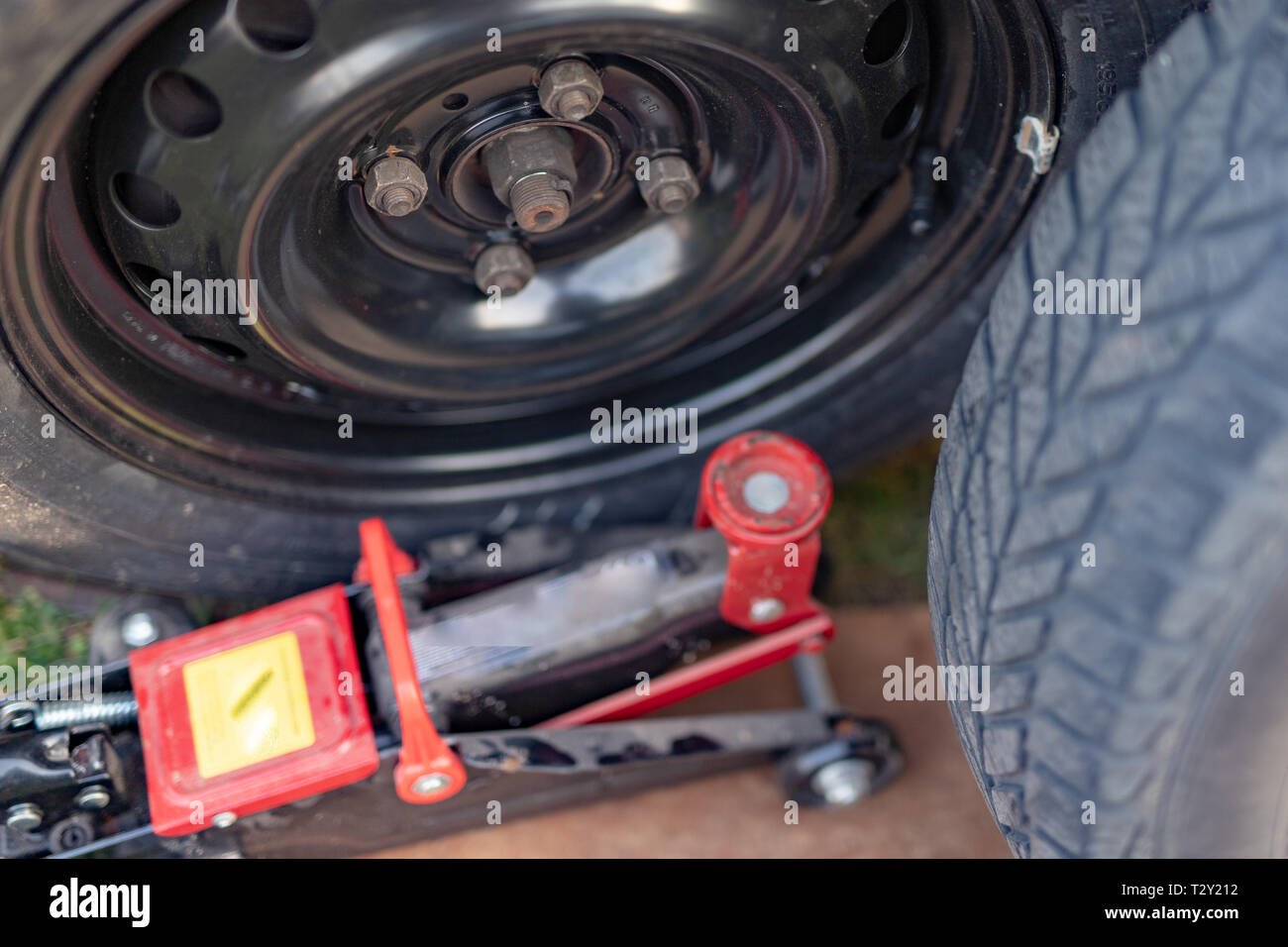 Replacing the wheel in a passenger car. Changing wheels from winter to ...