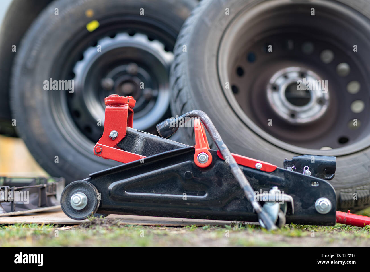 Replacing the wheel in a passenger car. Changing wheels from winter to ...