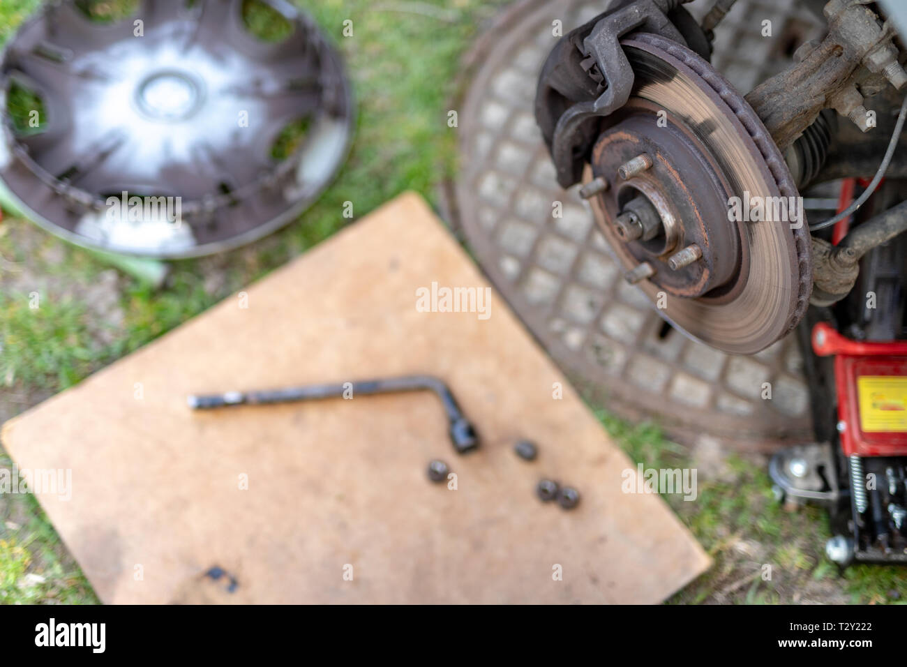 Replacing the wheel in a passenger car. Changing wheels from winter to ...