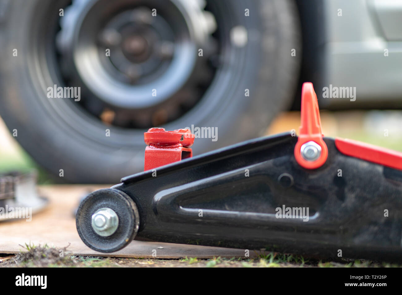 Replacing the wheel in a passenger car. Changing wheels from winter to ...