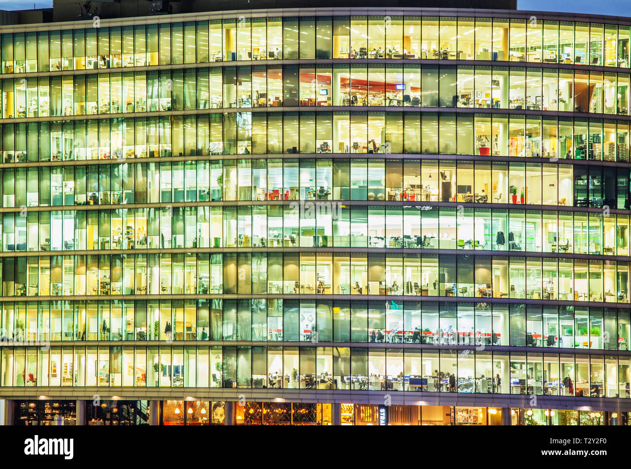 Modern office block at night Stock Photo - Alamy