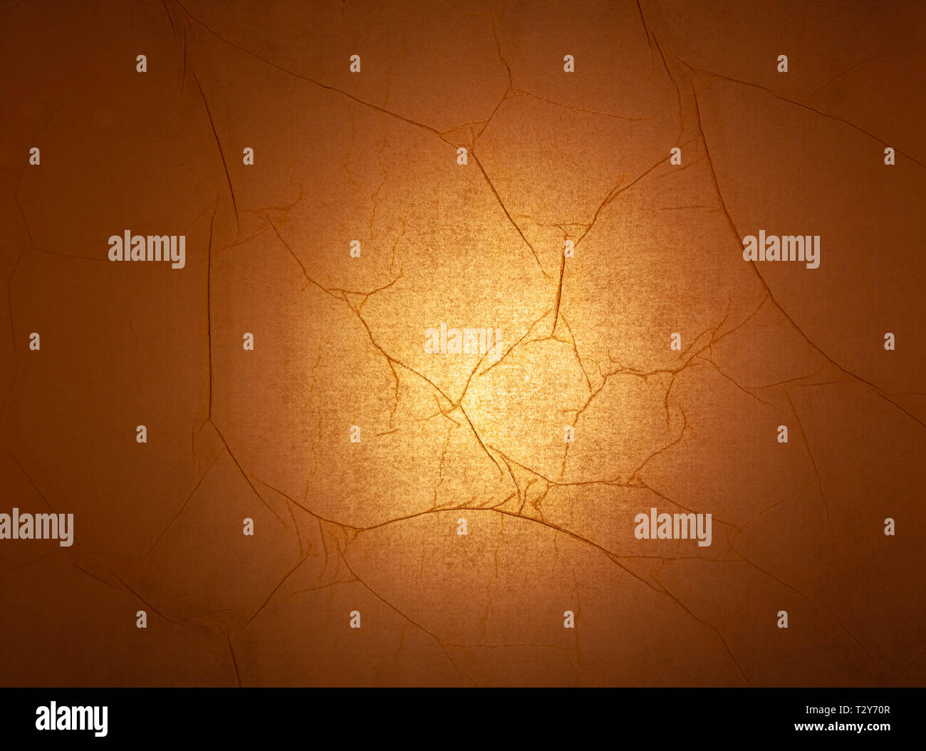 Light glowing behind cracked rice paper background texture overlay ...