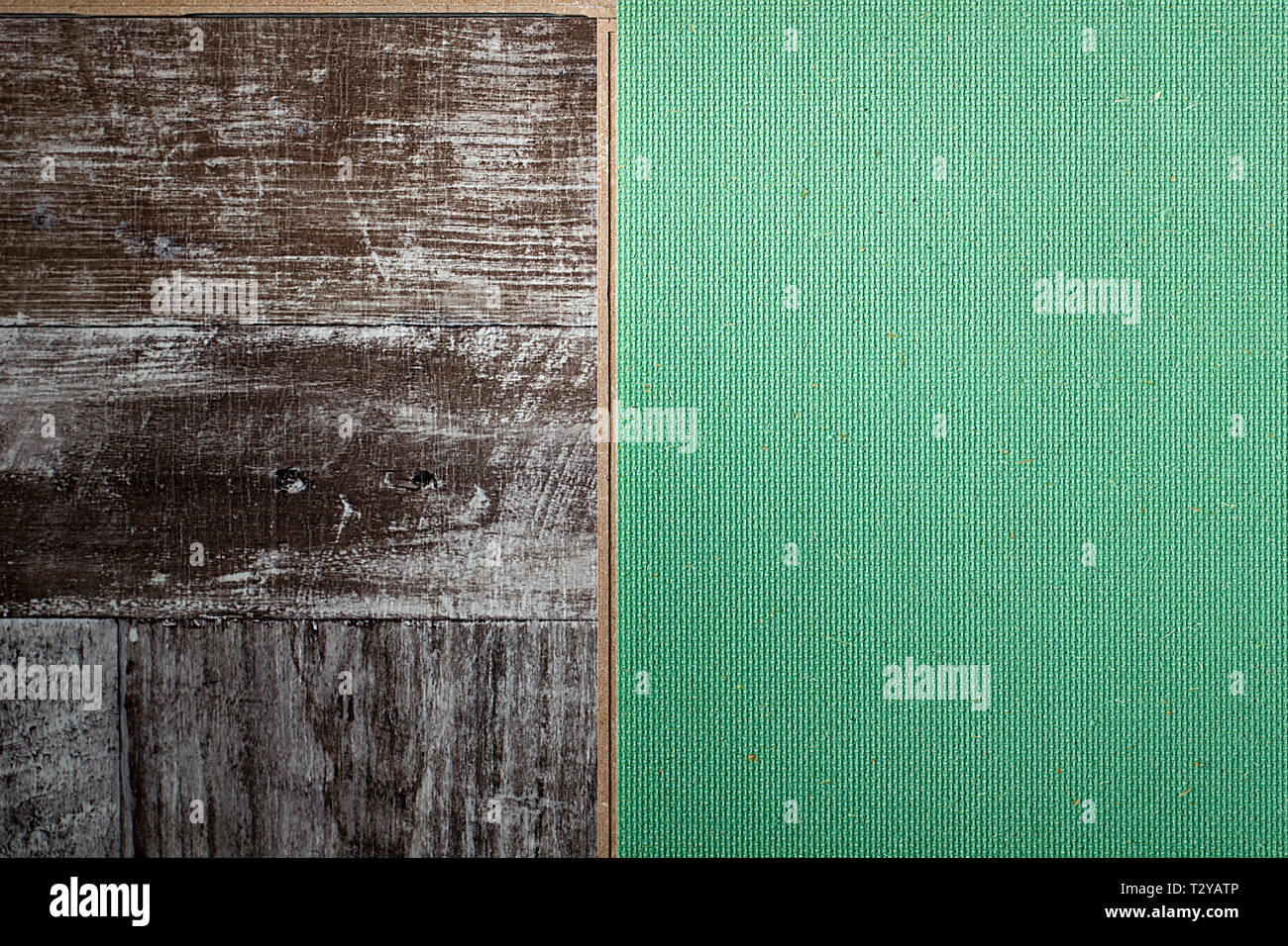 Laying laminate flooring. Laminate and substrate green Stock Photo - Alamy