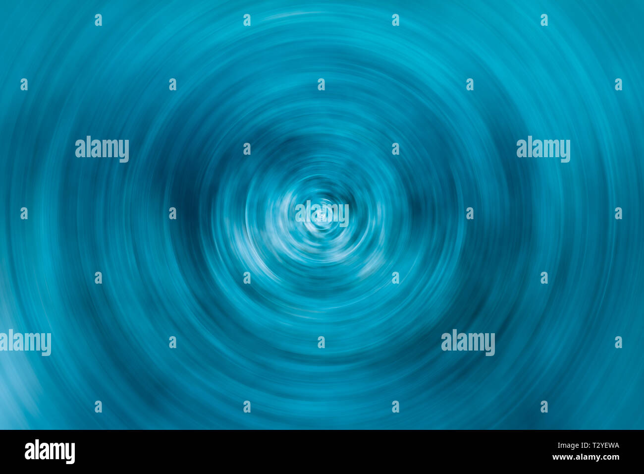Abstract blue spinning circle with random light spots for background or ...