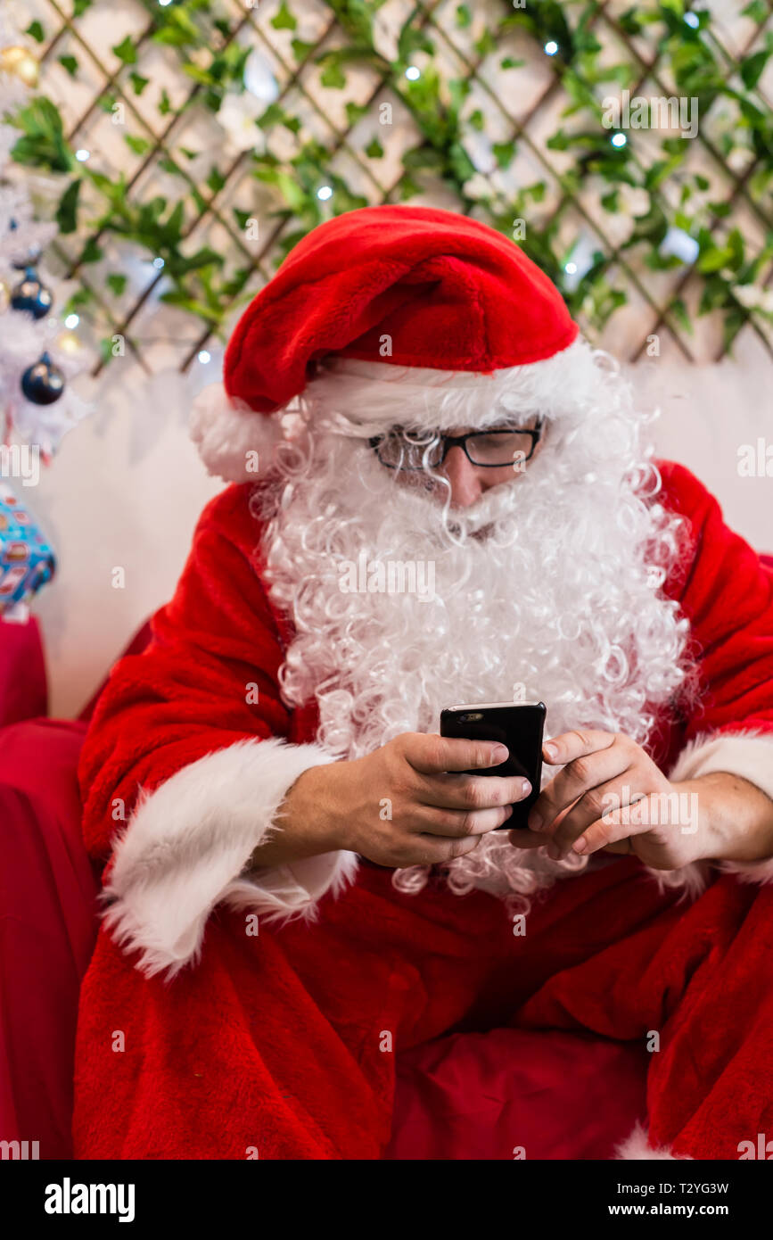 santa using cellphone Stock Photo - Alamy