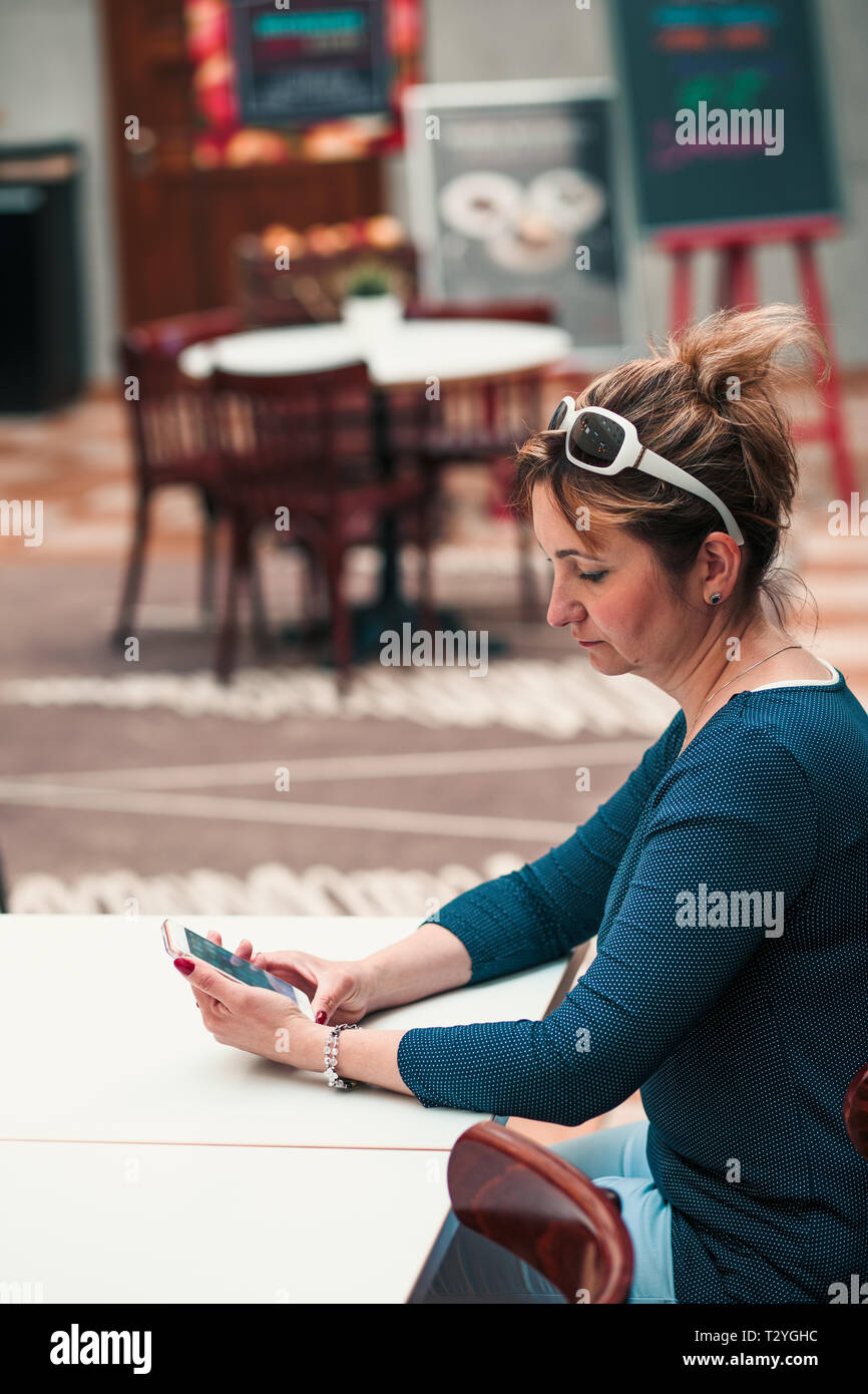 Using a mobile phone in public hi-res stock photography and images - Alamy