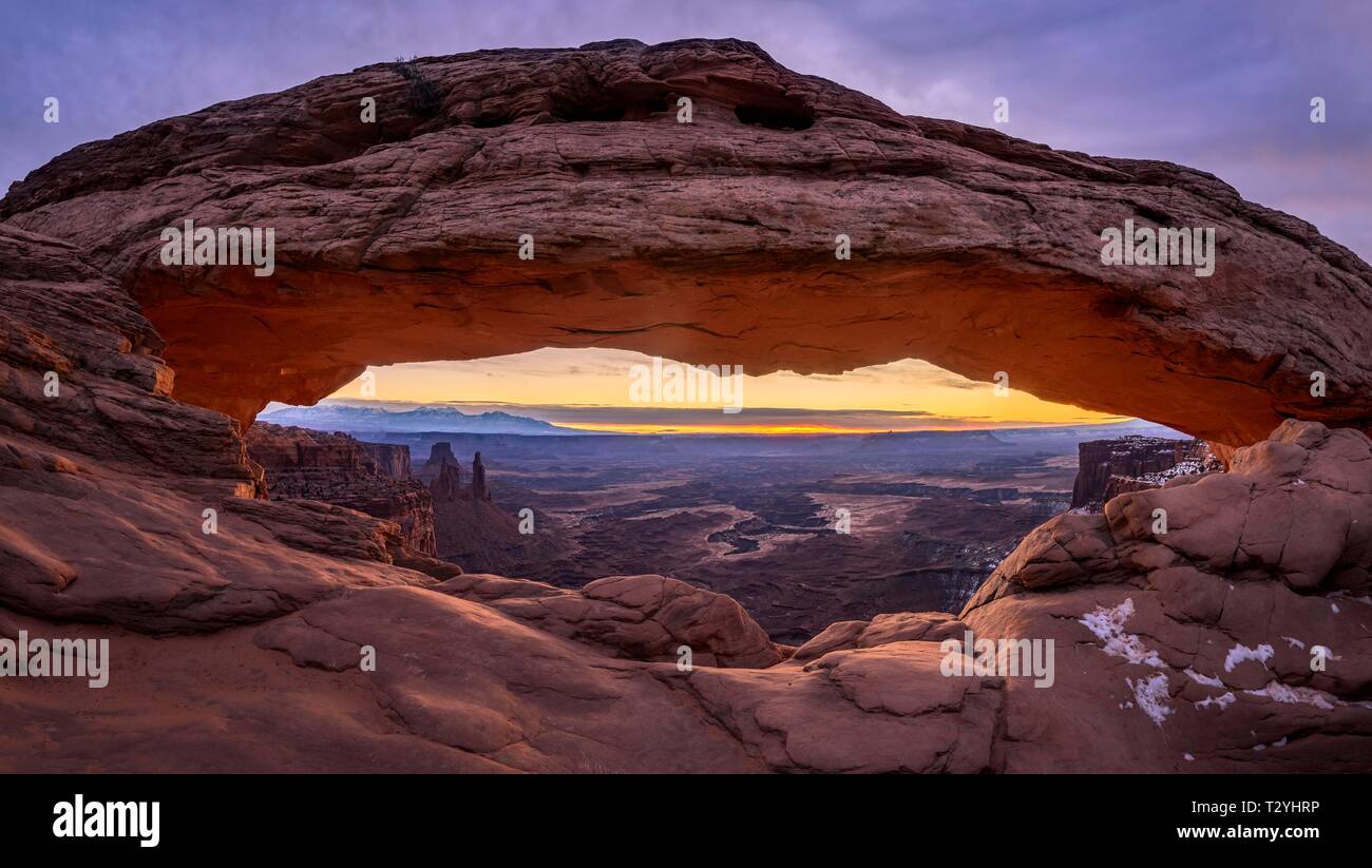 View through arch Mesa Arch at sunrise, Colorado River Canyon with the ...