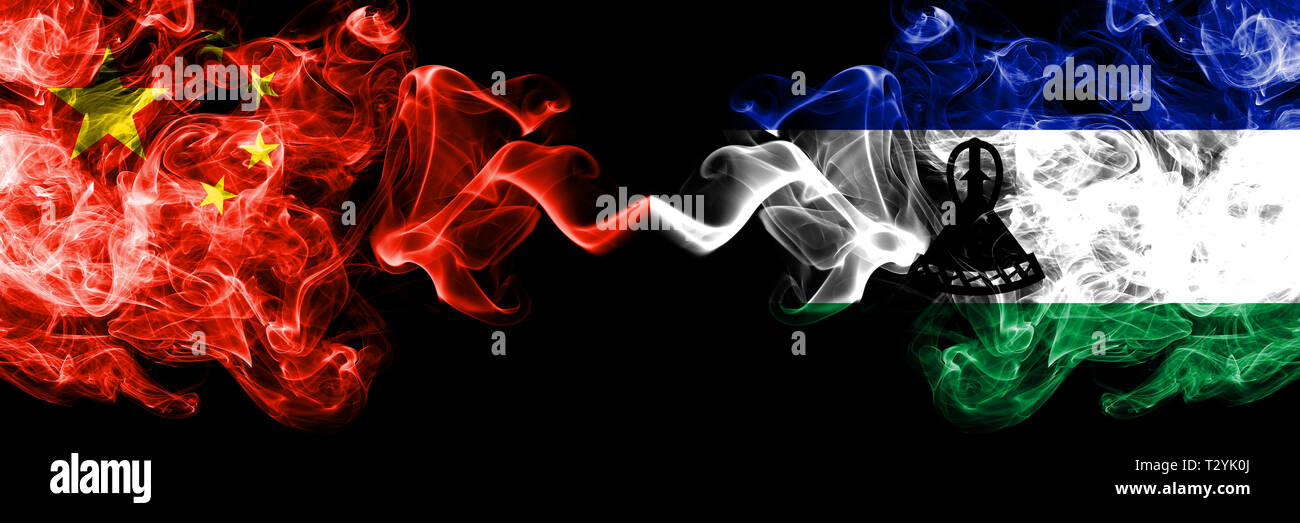 China vs Lesotho smoke flags placed side by side. Thick colored silky ...