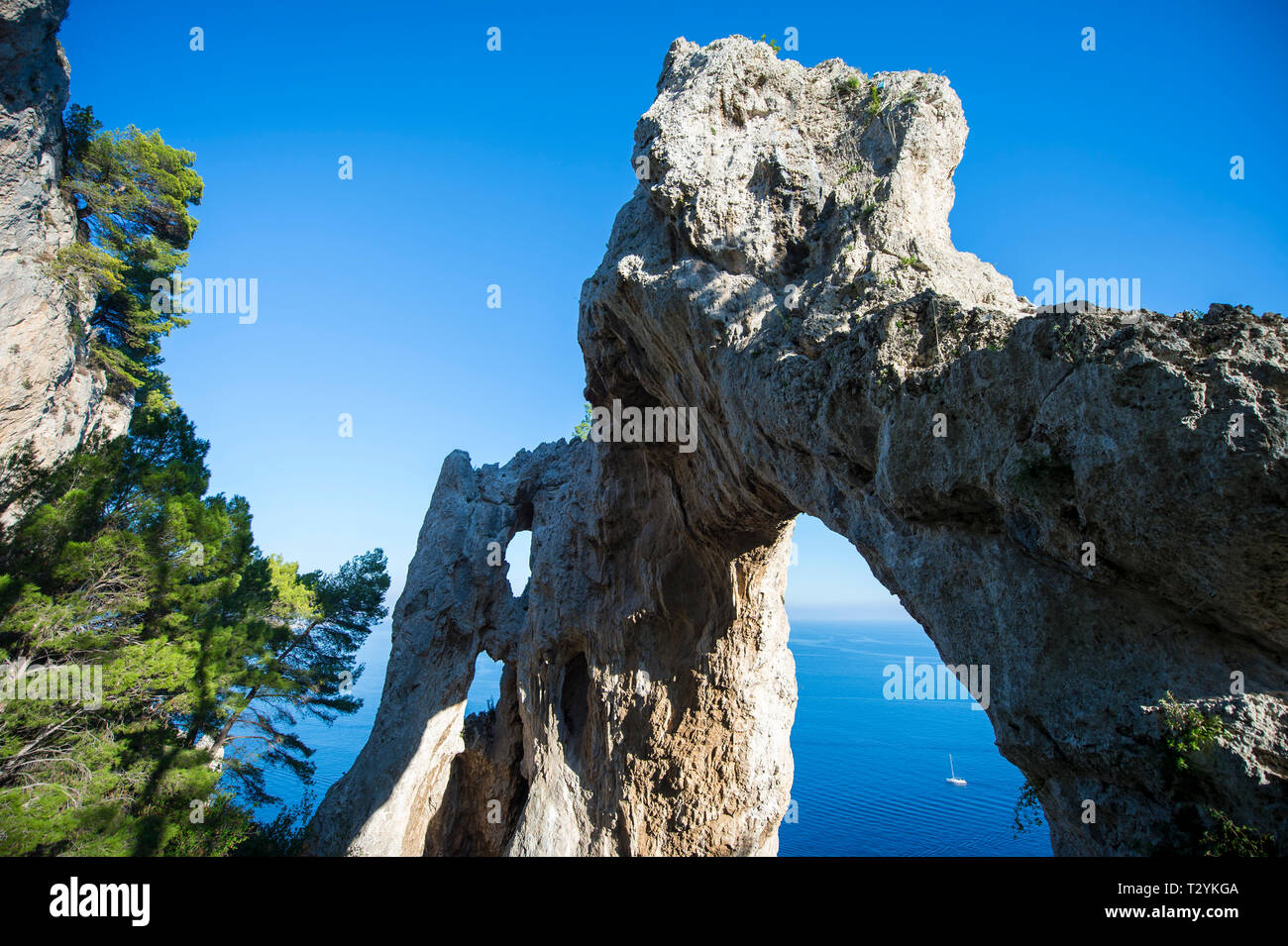 Scenic afternoon view through the Arco Naturale natural stone arch in ...