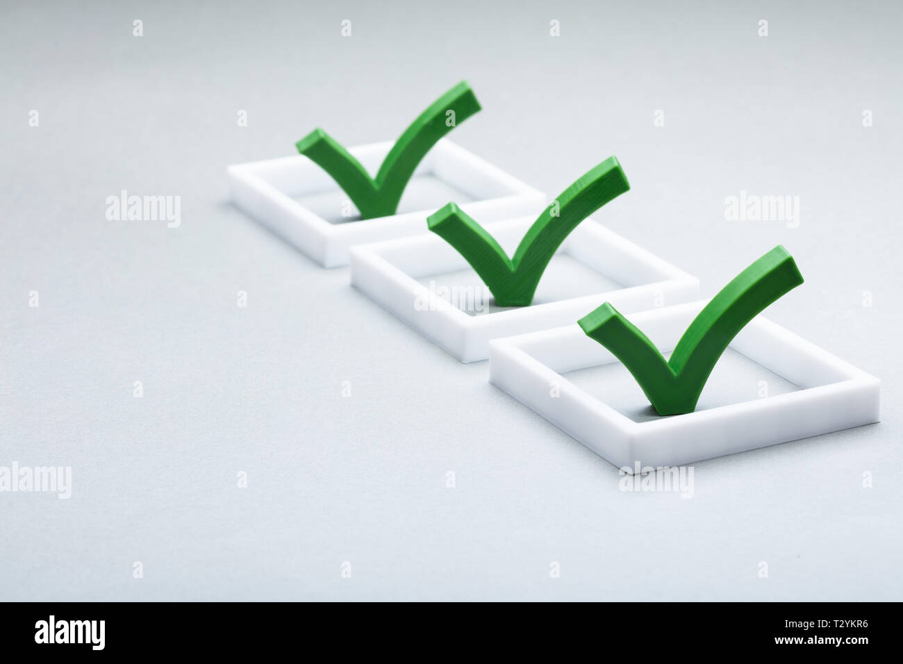 Close-up Of Green Check Marks Sign Arranged White Blocks Against White ...