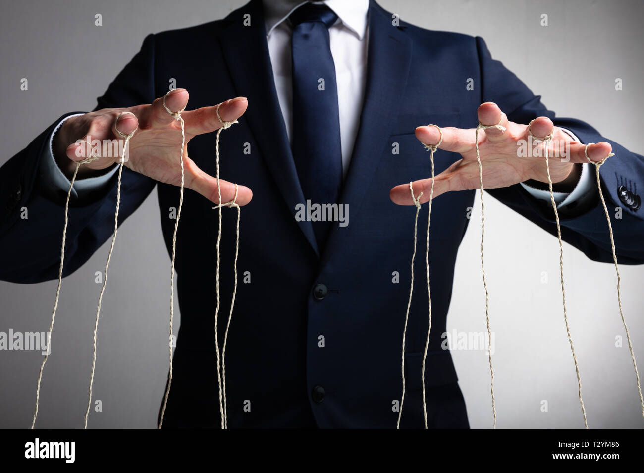 Man's Hand Controls The Puppet With The Fingers Attached To Threads ...