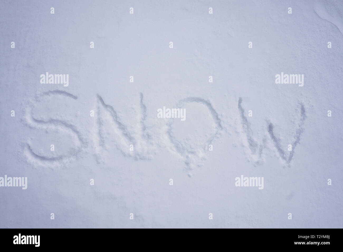 Snow word written in a cold snow background Stock Photo - Alamy