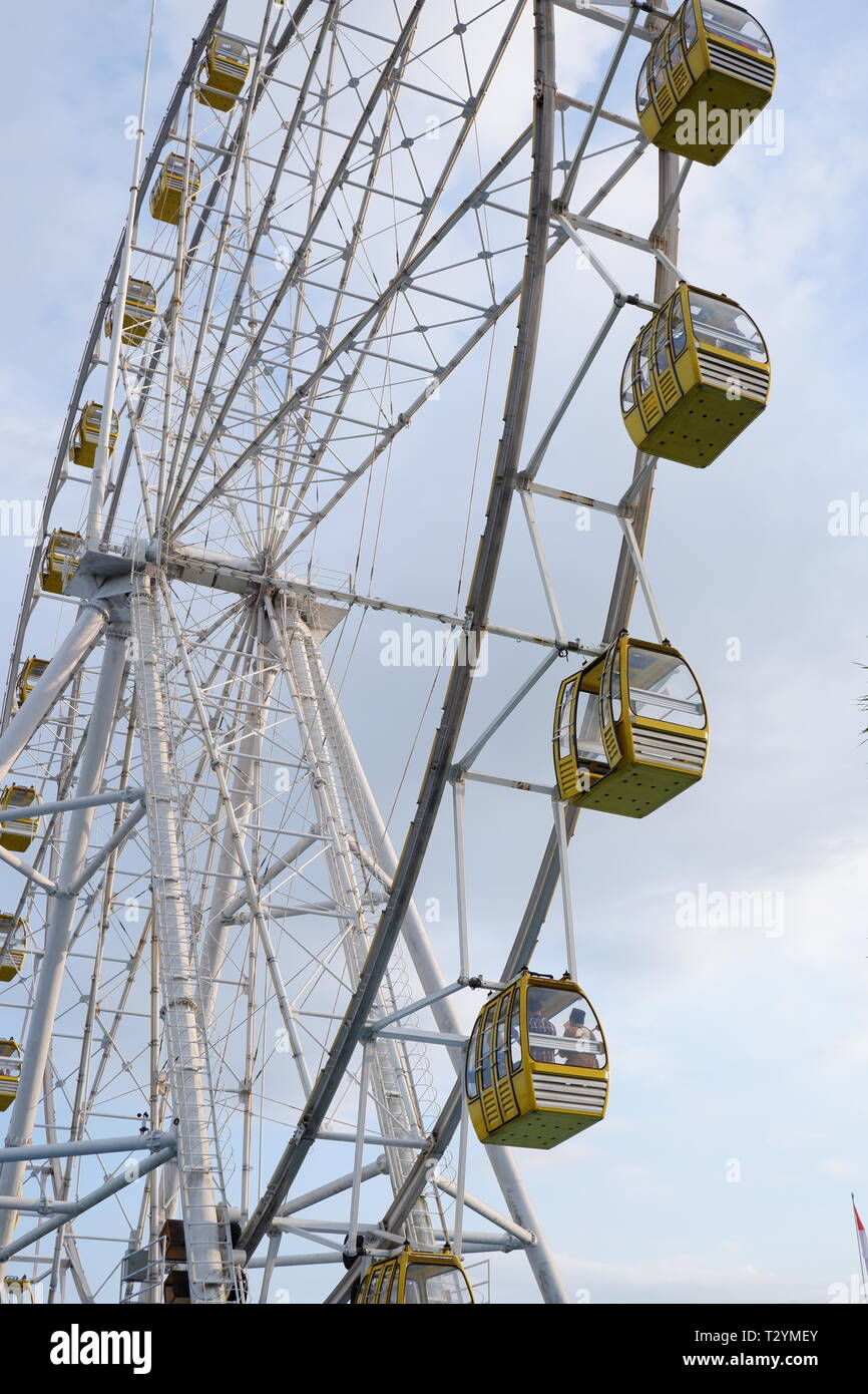 low angle of yellow ferris wheel with sky background Stock Photo - Alamy