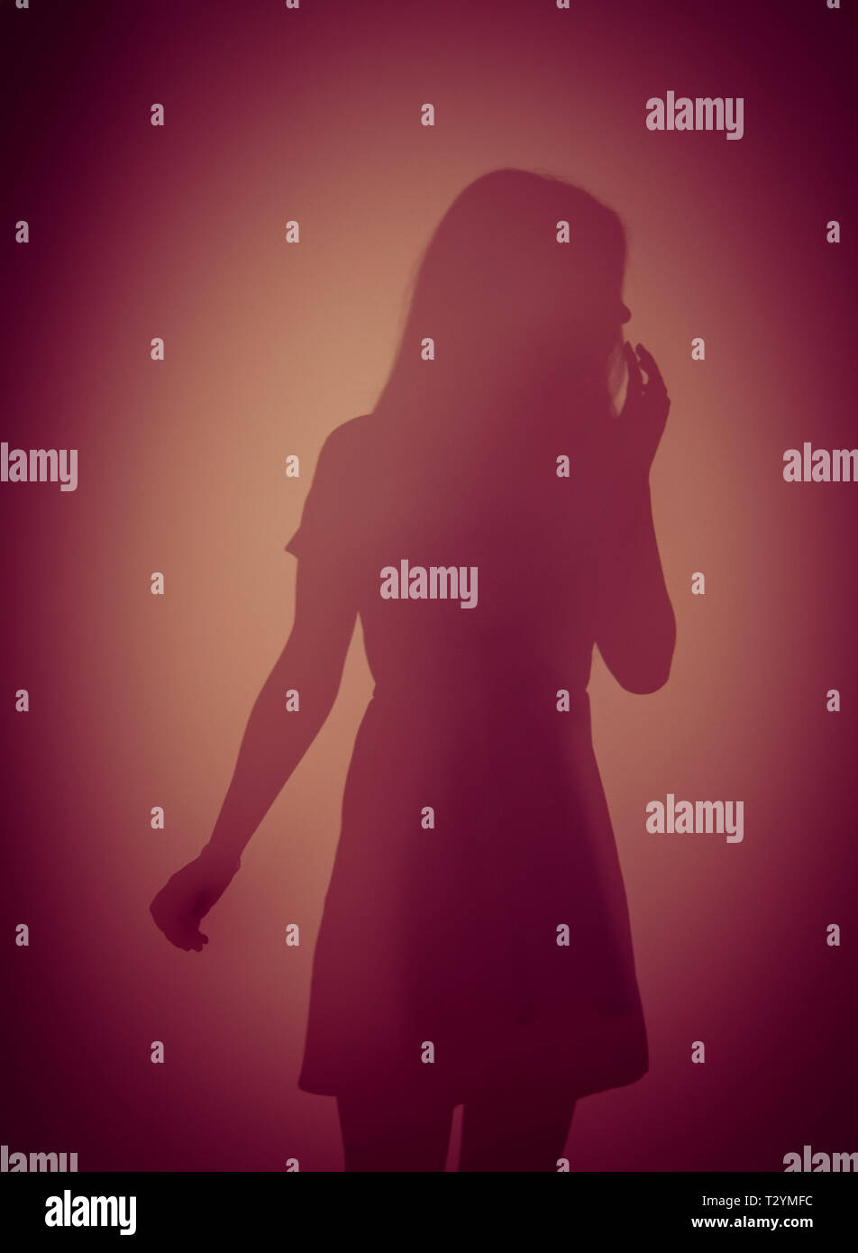 Blurred photo girl wearing dress dancing behind glass Stock Photo - Alamy