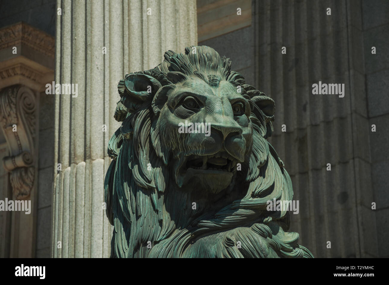 Sculpture of imposing lion cast in bronze on facade of Palacio de las ...