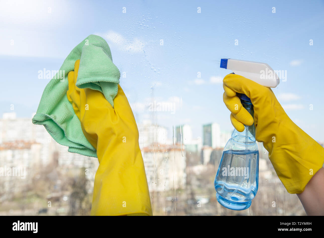 Cleaning windows with special rag and cleaner. spring cleaning Stock ...