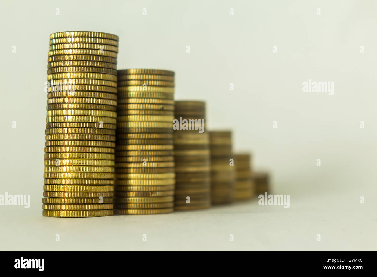 Stacks of copper coins on a white background. Ascending movement. A ...
