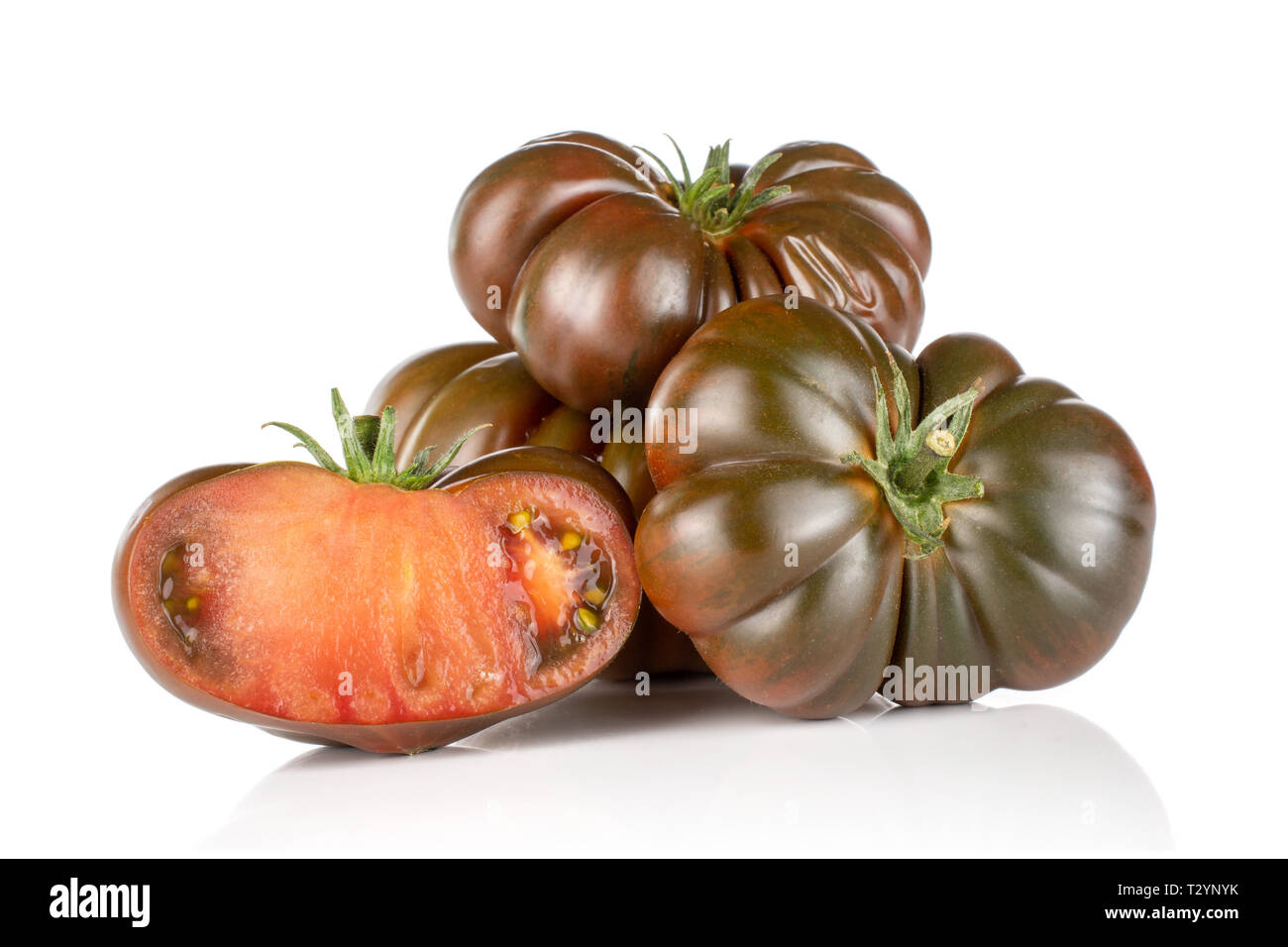 Group of three whole one half of dark fresh tomato primora isolated on ...